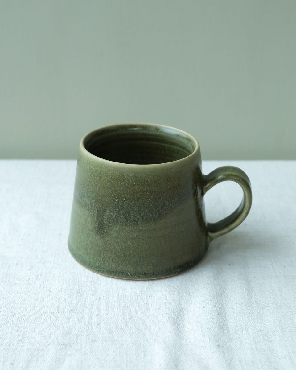 Stoneware taper mug with moss glaze, made by Sophia McEvoy – Land Tales
